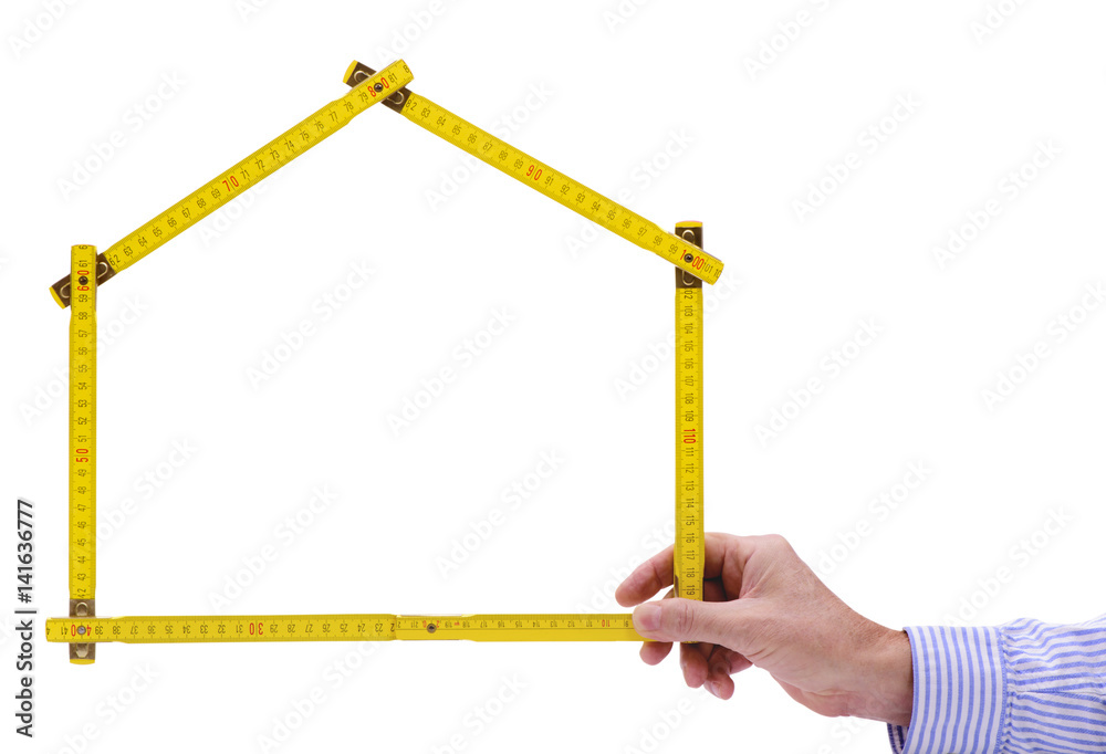 Meterstab gefaltet in Form von einem Haus Stock Photo | Adobe Stock
