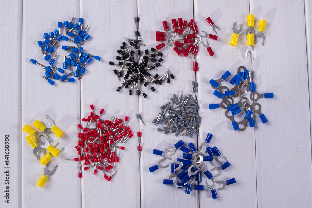 Cable lug in different colors and sizes on a white background. Electric ...