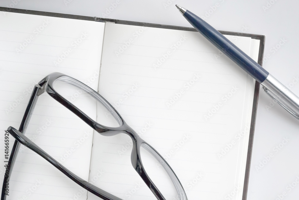pen, glasses and notepad for writing text Stock Photo | Adobe Stock