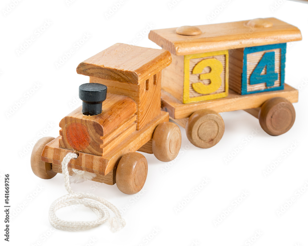Colored children's wooden toy train with digit cubes, isolated on a ...