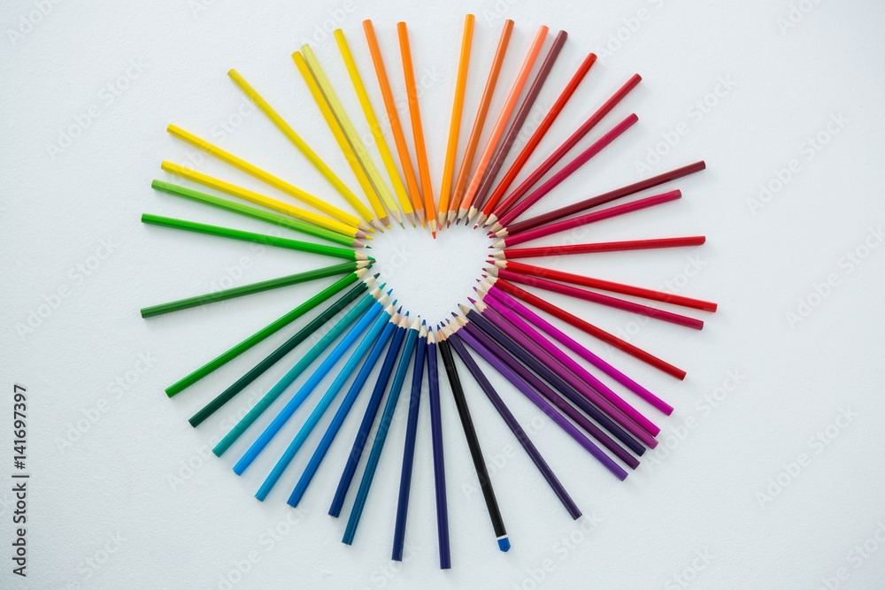 Colored pencils arranged in heart shape on white background Stock Photo ...