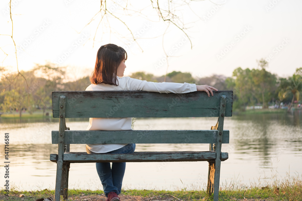 Girl Sitting Alone In Garden