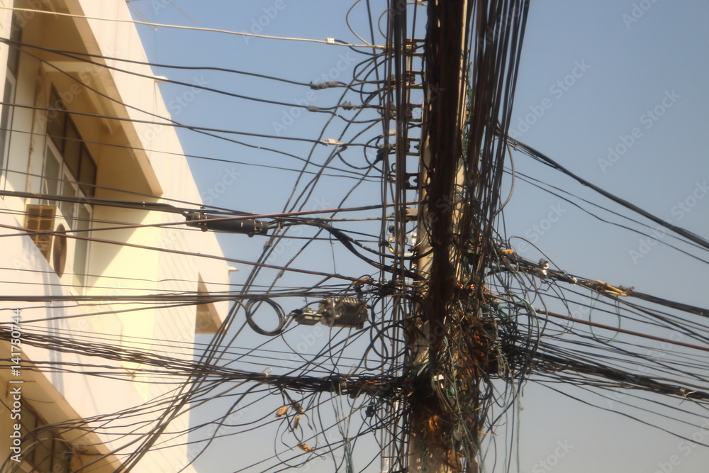 Power poles and many telephone lines in the communication era without ...