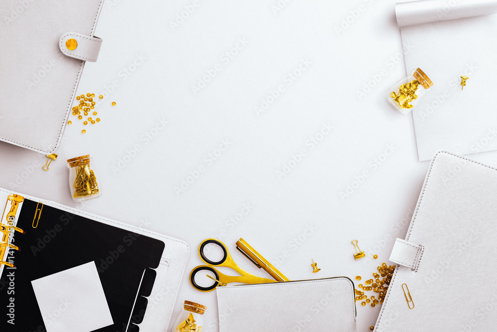 Planner in open and closed positions on a white desk background, black ...