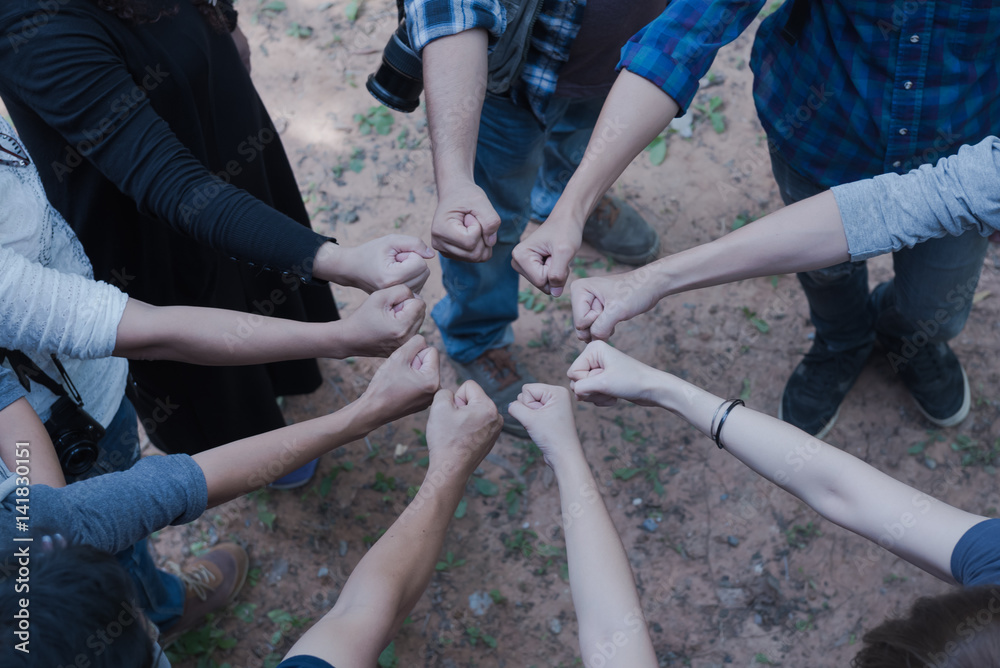 Group of young people United Hands together expressing positive ...