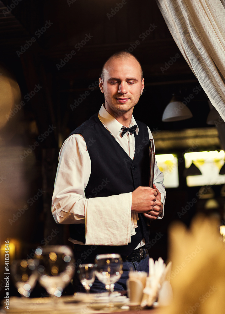 Waiter served table in the restaurant before the feast,Waiter in ...