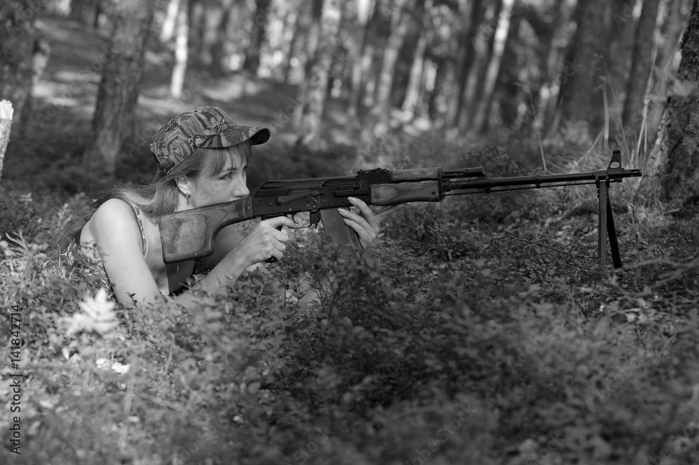 Beautiful girl in the woods with a machine gun Kalashnikov Stock Photo ...