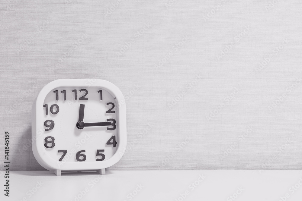 Closeup white clock for decorate show a quarter past twelve o'clock or ...