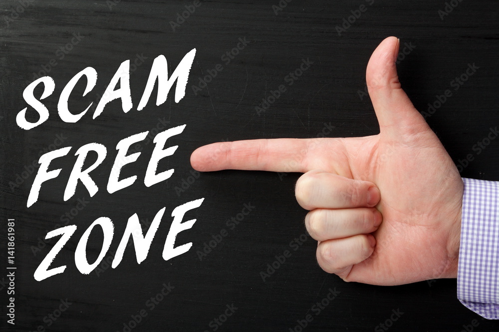 Human hand pointing a finger at the words Scam Free Zone in white text ...