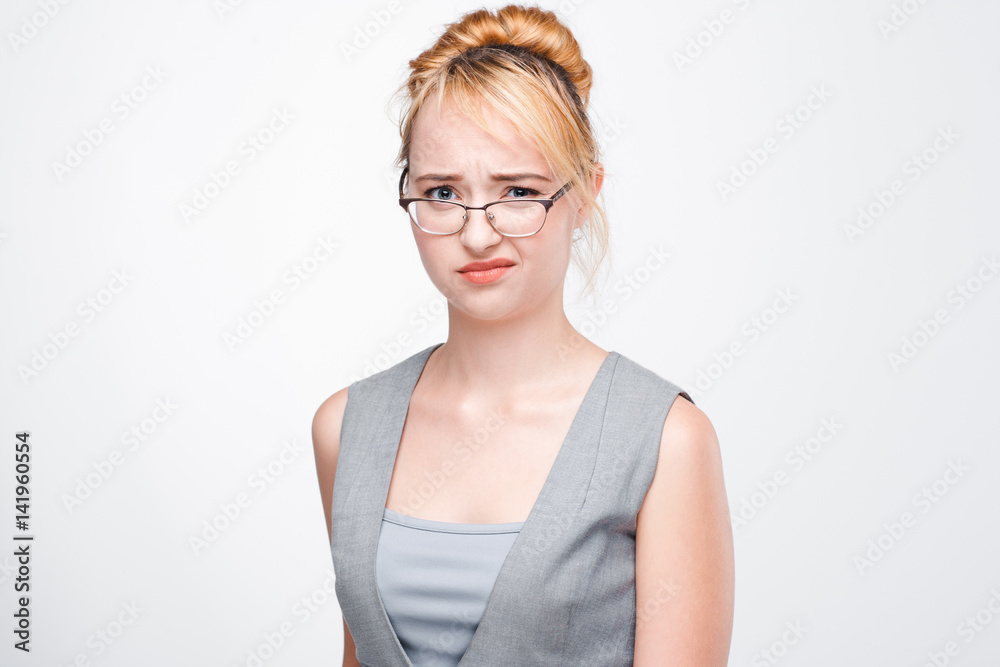 Young blonde in glasses shows contempt and neglect. Too high self ...