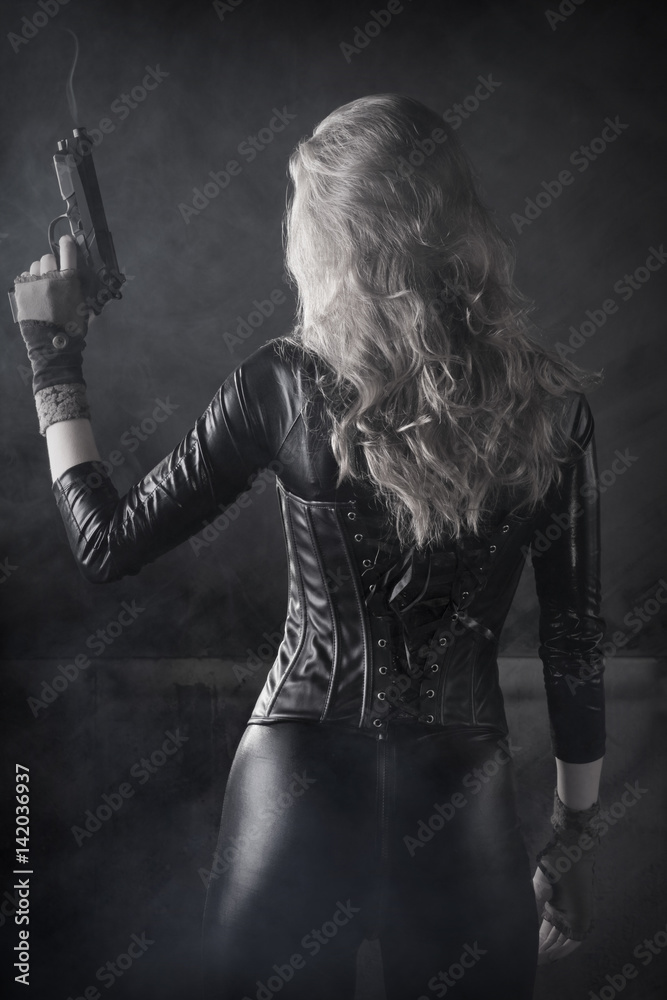 Female Assassin with gun Stock Photo | Adobe Stock