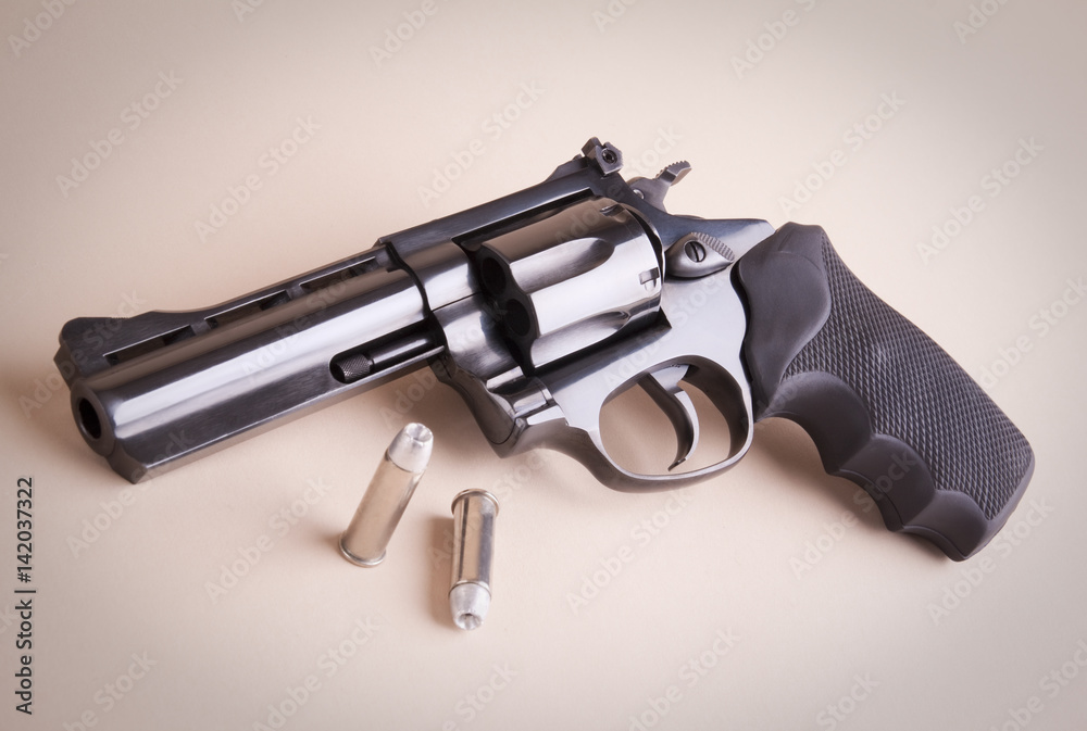 Revolver with bullets Stock Photo | Adobe Stock