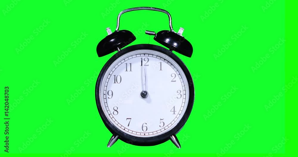 Video footage of an alarm clock ringing at twelve o'clock, shot with ...