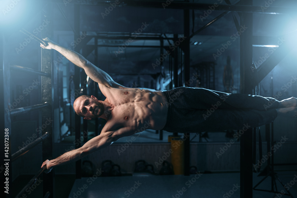 Athlete with muscular body training on bar Stock Photo | Adobe Stock