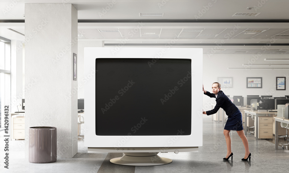 Secretary and big computer monitor Stock 写真 | Adobe Stock