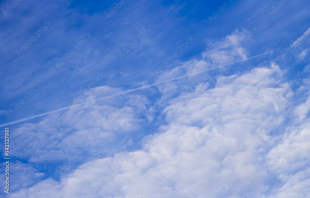 Flying far away in sky plane Stock Photo | Adobe Stock