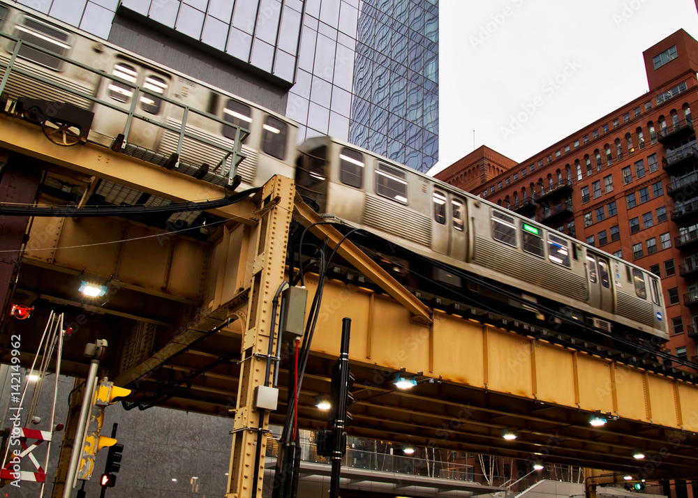 Chicago's Transit System's Elevated (El) Train - speeding by on raised ...