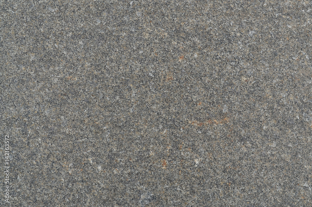 The texture of solid granite tiles. Hard and slippery gray granite ...
