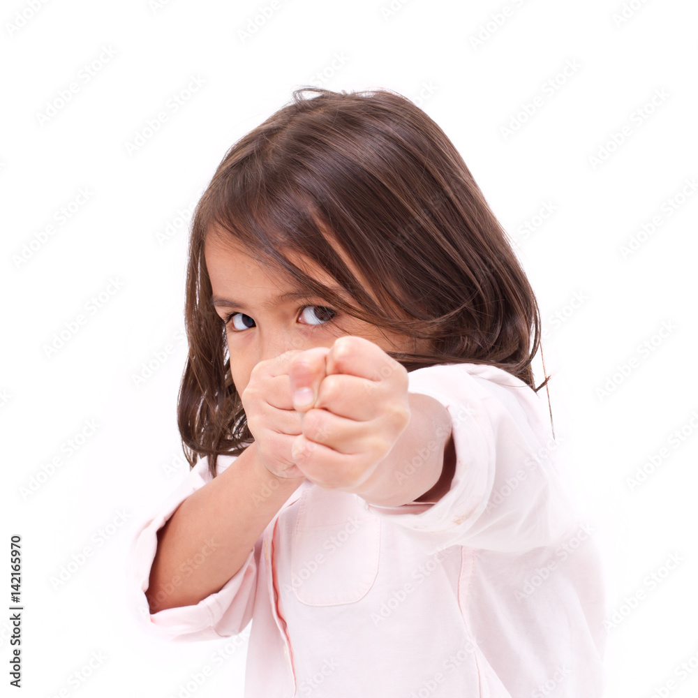 little girl assuming stance, practicing martial arts, self-defense ...