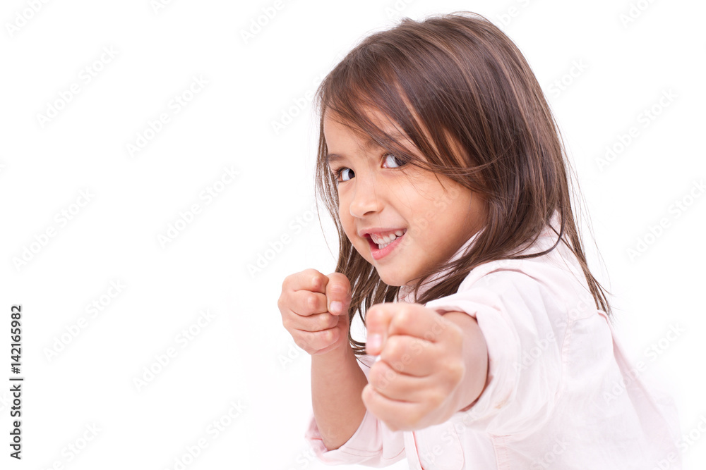 little girl assuming stance, practicing martial arts, self-defense ...