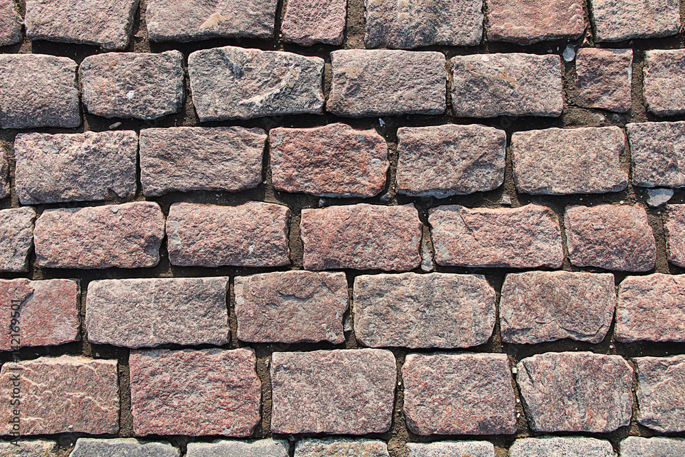 Texture of a red rectangular cobblestone. Stock Photo | Adobe Stock