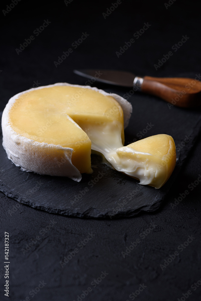 Butter soft creamy sheep cheese from Seia region Portugal on black ...