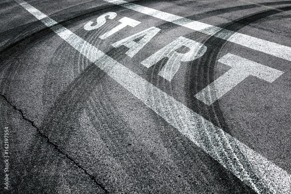 Race start line pattern background on the asphalt floor with crossing ...