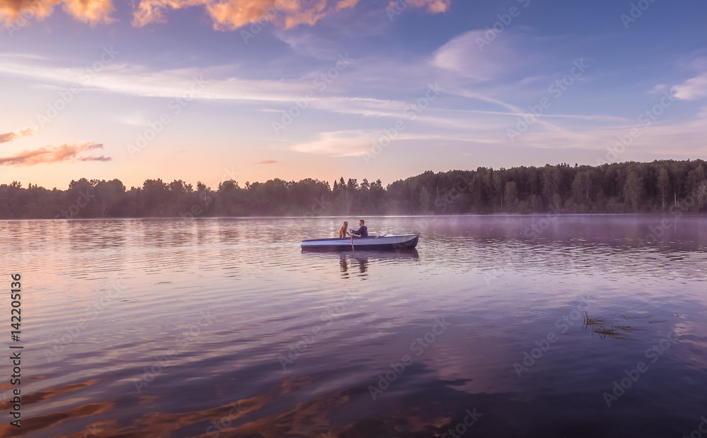 Romantic golden sunset river lake fog loving couple small rowing boat ...
