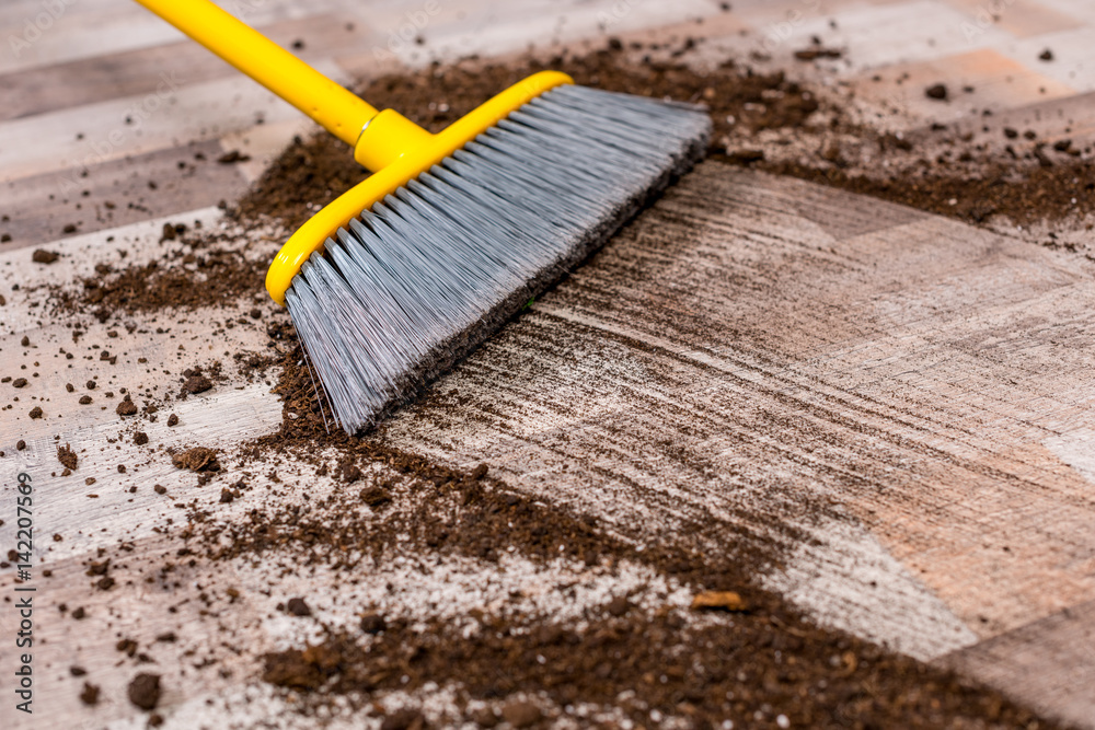 Broom sweeping floor Stock Photo | Adobe Stock