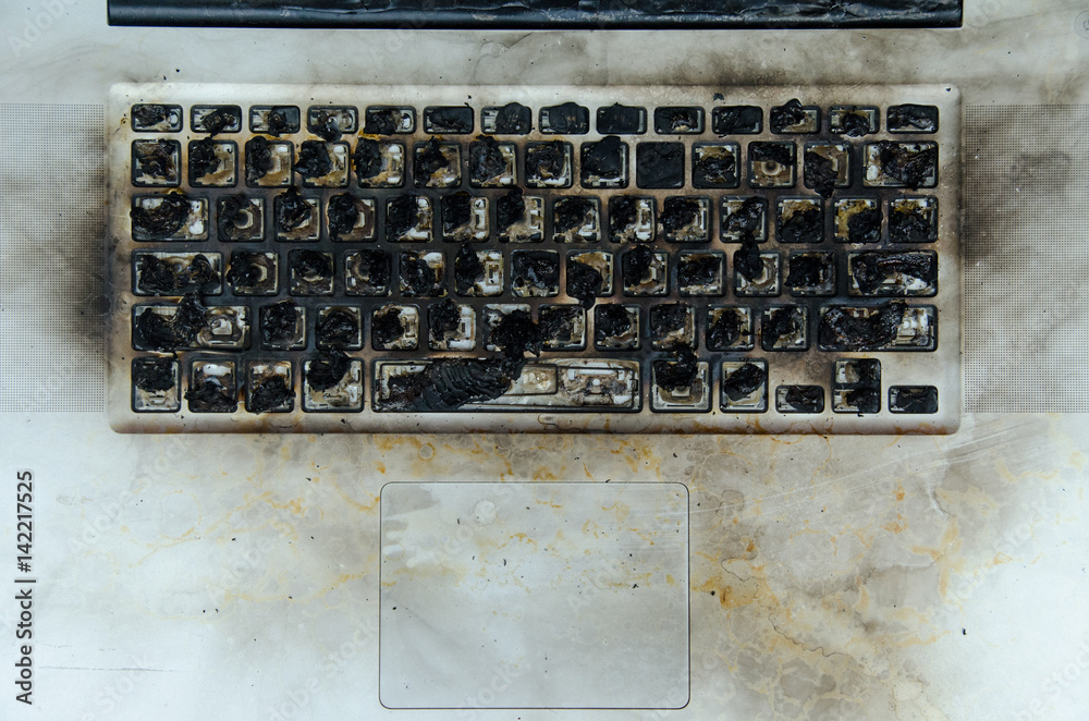 Laptop keyboard badly burnt and melted from fire Stock-Foto | Adobe Stock