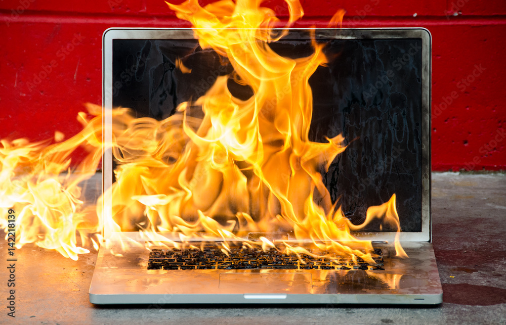 Laptop computer consumed by fire and flames Stock Photo | Adobe Stock