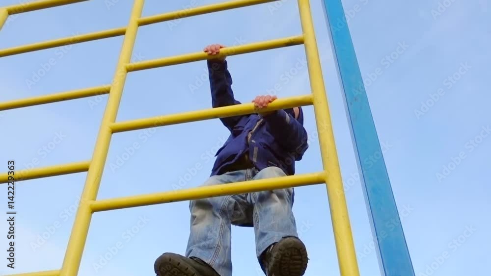 Little kid climbing on ladder in playground Stock Video | Adobe Stock