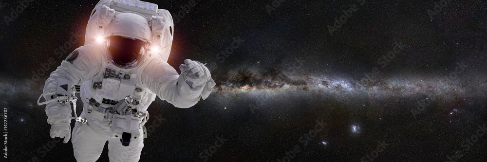 astronaut in front of the Milky Way (banner format 3x1, elements of ...