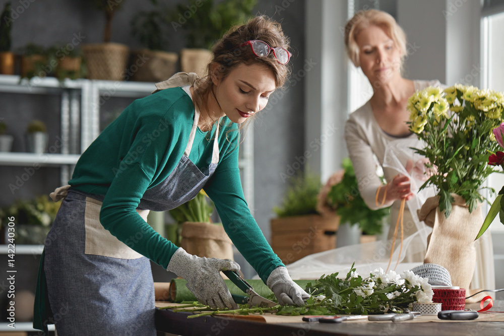 Flower shop employees Stock Photo | Adobe Stock