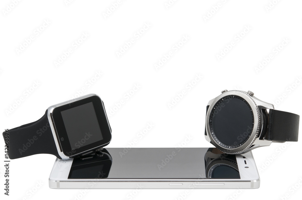 Smart watch lying next to the phone isolated on a white background ...