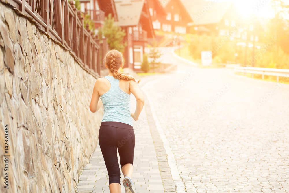 Young slim woman in sportswear jogging in the morning. Healthy ...