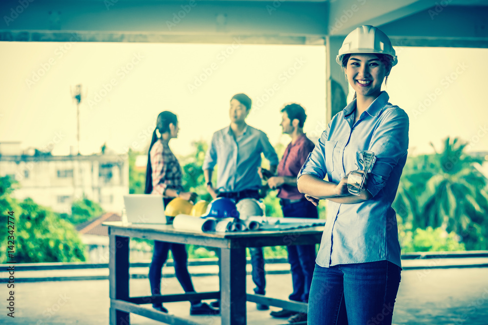 Portrait of Happy professional construction engineer woman holding the ...