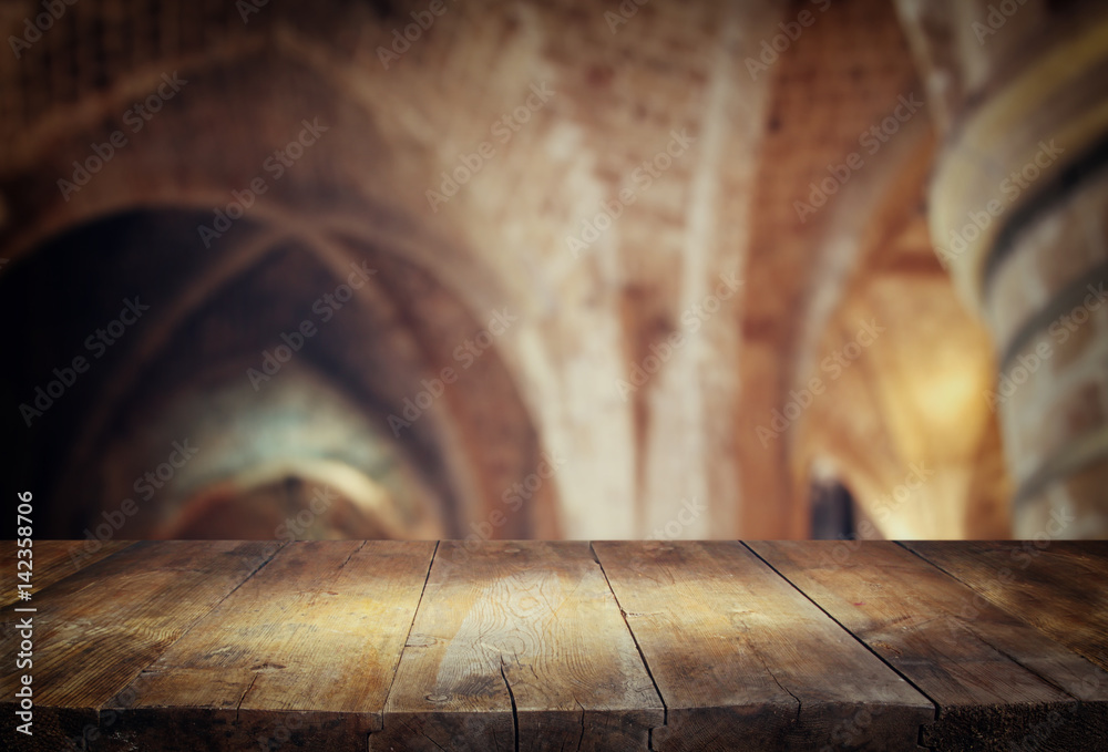 table in front of abstract blurred church interior background Stock ...