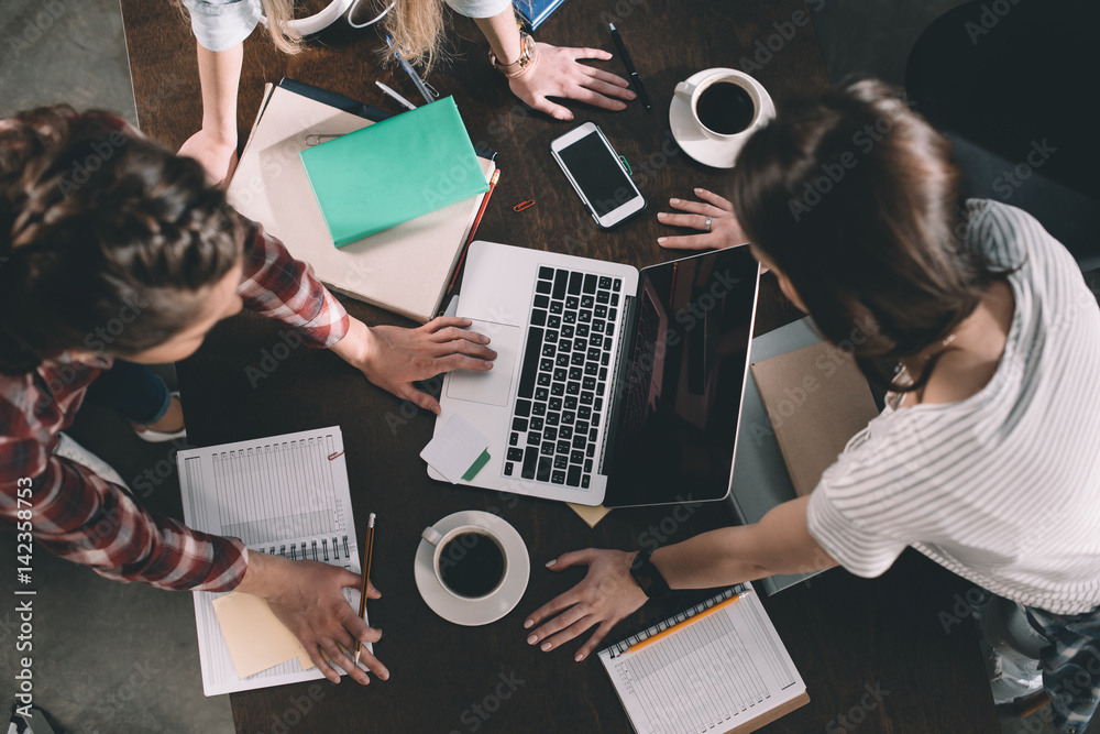 top view of women studying with books and laptop Stock Photo | Adobe Stock