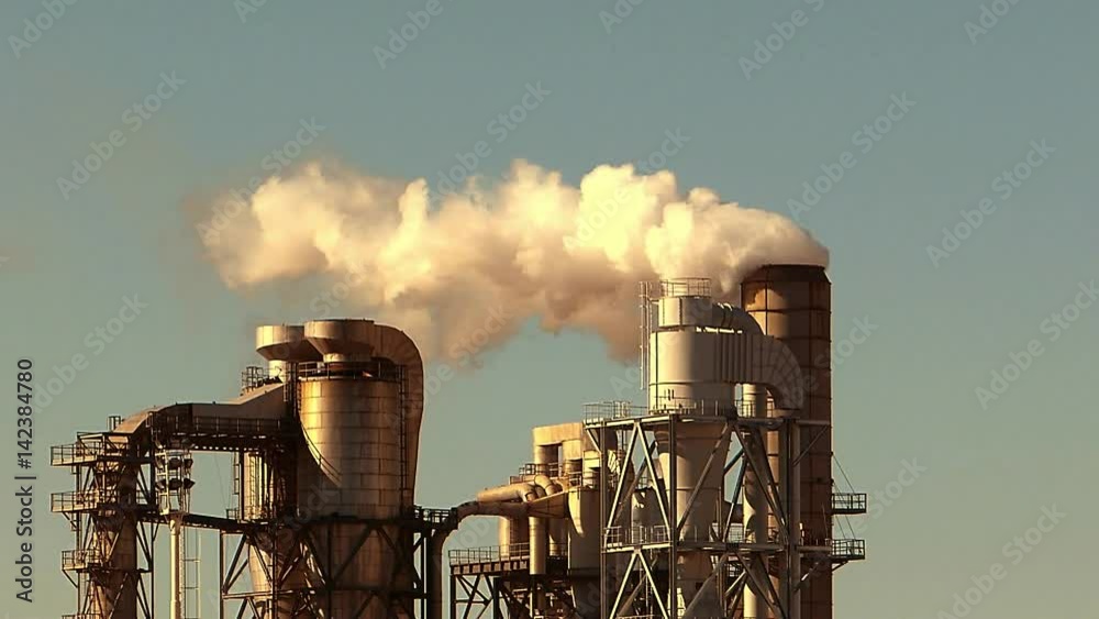 Smokestacks of a factory emits smog. Chimneys of a chemical plant. Pipe ...