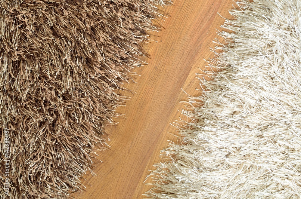 Brown and white hairy carpets divide in half and floating floor Stock ...