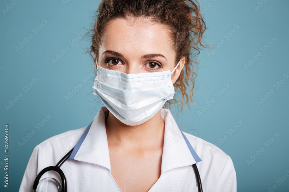 Young female medical nurse or doctor wearing protective mask Stock ...