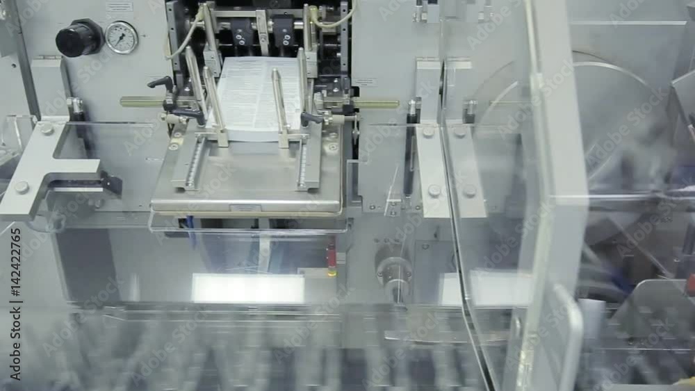 interior of a pharmaceutical industry equipment for packing pills boxes ...