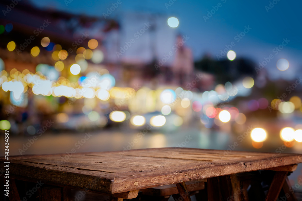 Empty top wood table and blur city night background. Product display ...