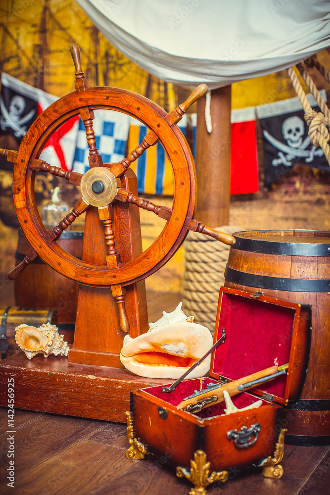 Decoration of the room in a pirate style, with a helm and a treasure ...