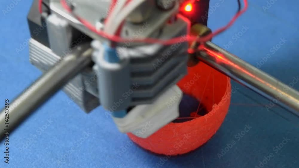 3D printer in operation close-up. Automatic three dimensional 3d ...