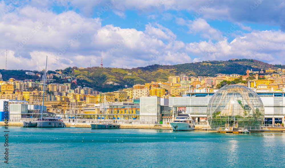 View of the port of genoa dominated by an aquarium and the biosphere ...