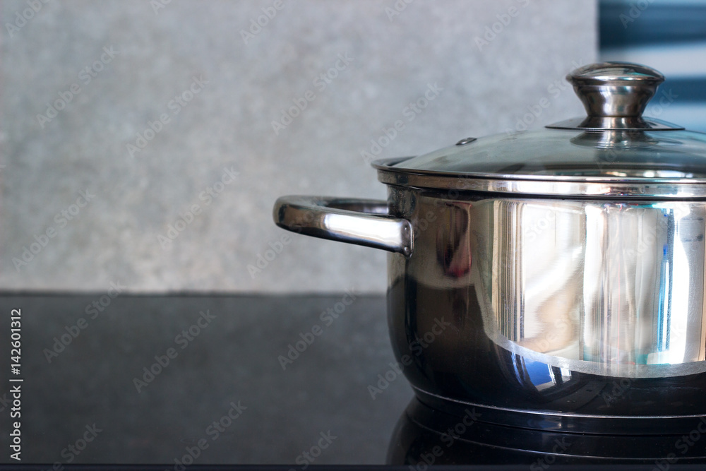 Big pot in modern kitchen with induction stove Stock Photo | Adobe Stock