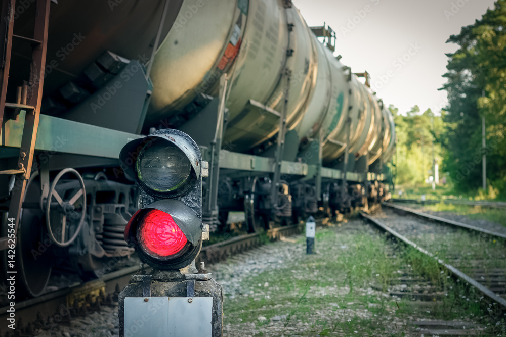 Railroad traffic light and freight train on behind Stock Photo | Adobe ...