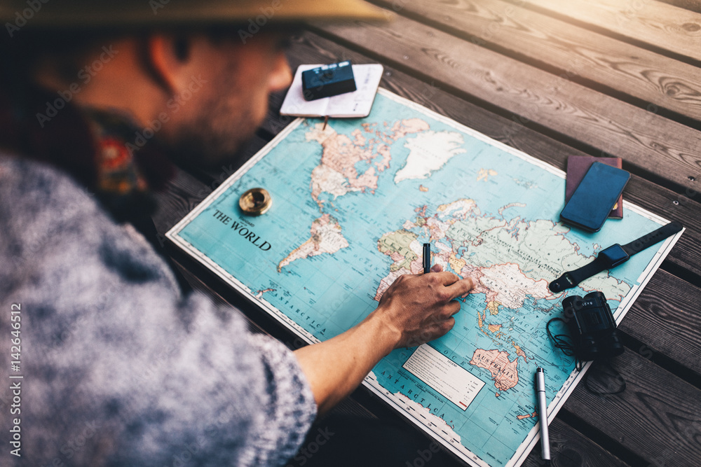 Tourist Planning tour using world map. Stock Photo | Adobe Stock